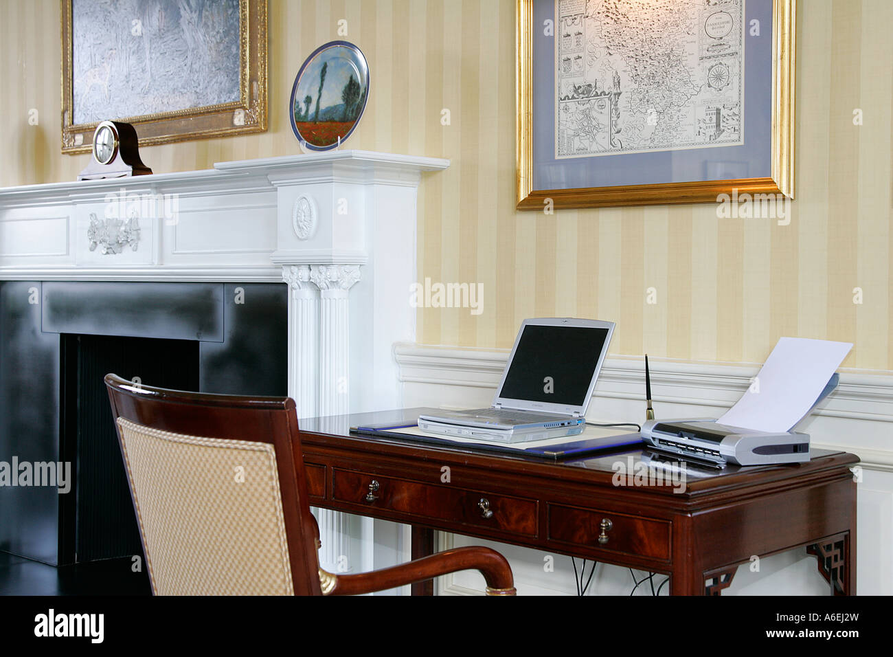 Laptop computer on hotel desk reception Stock Photo - Alamy
