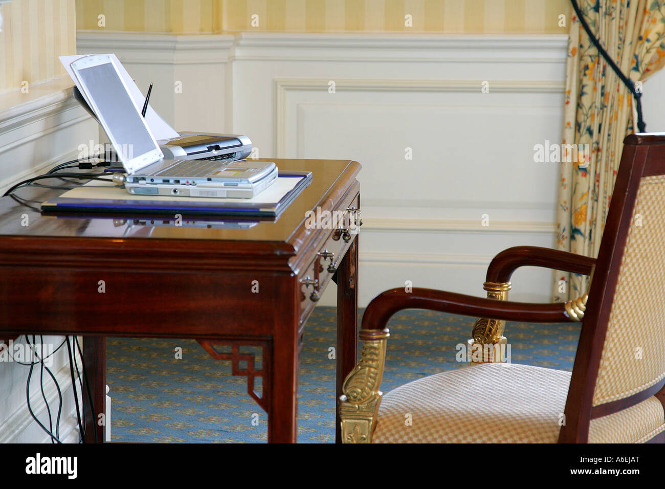 Laptop computer on hotel desk reception Stock Photo - Alamy