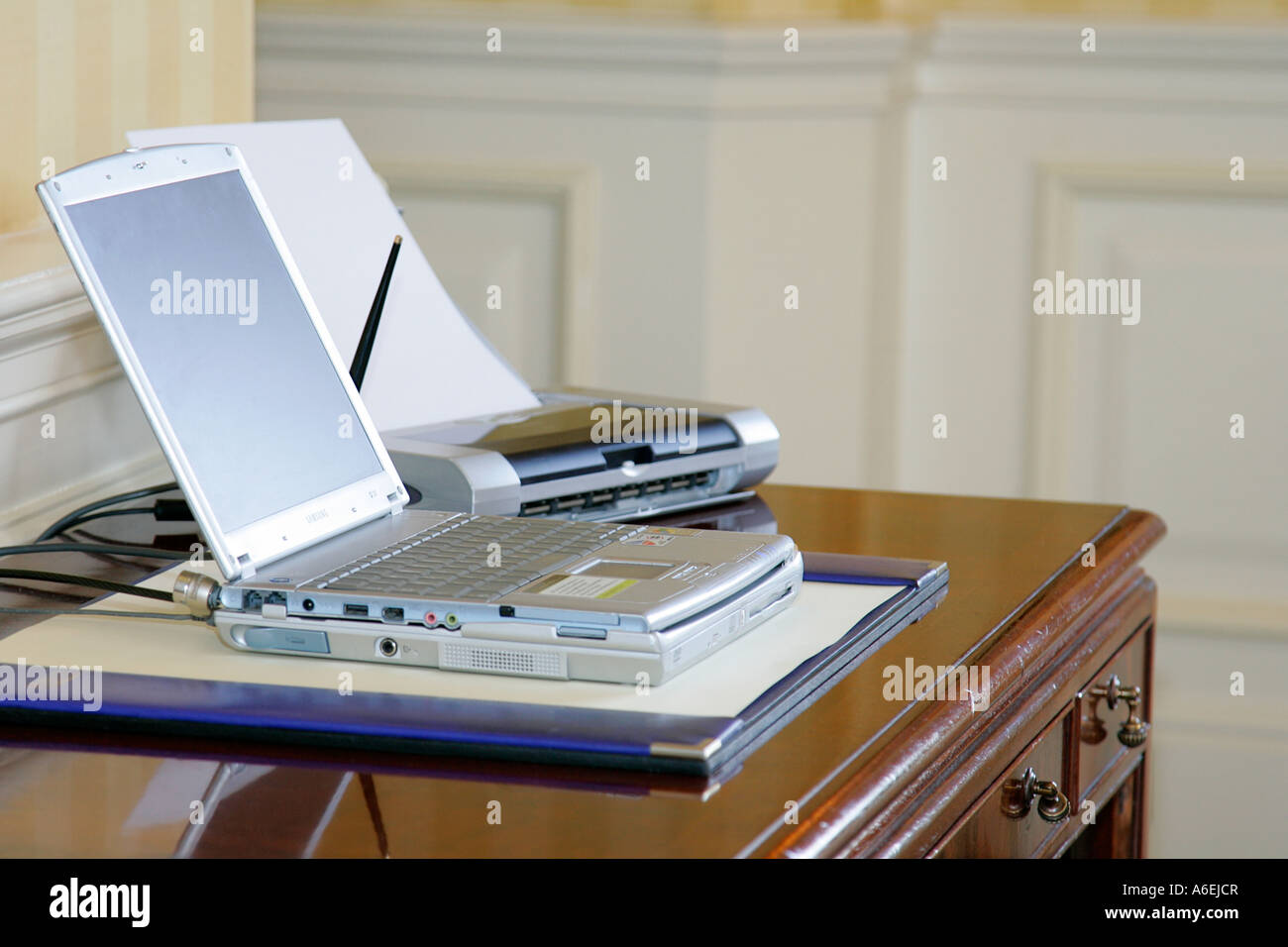 Laptop computer on hotel desk reception Stock Photo - Alamy
