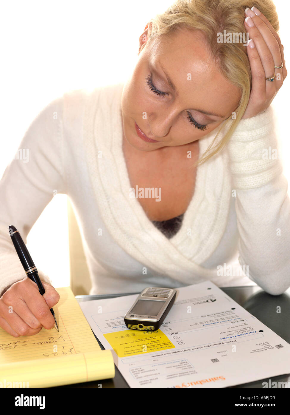 Young Woman Working Though And Calculating Her Annual Income Tax Return ...