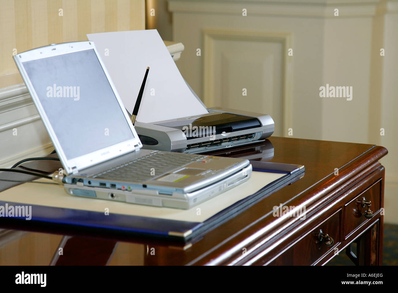 Laptop computer on hotel desk reception Stock Photo - Alamy