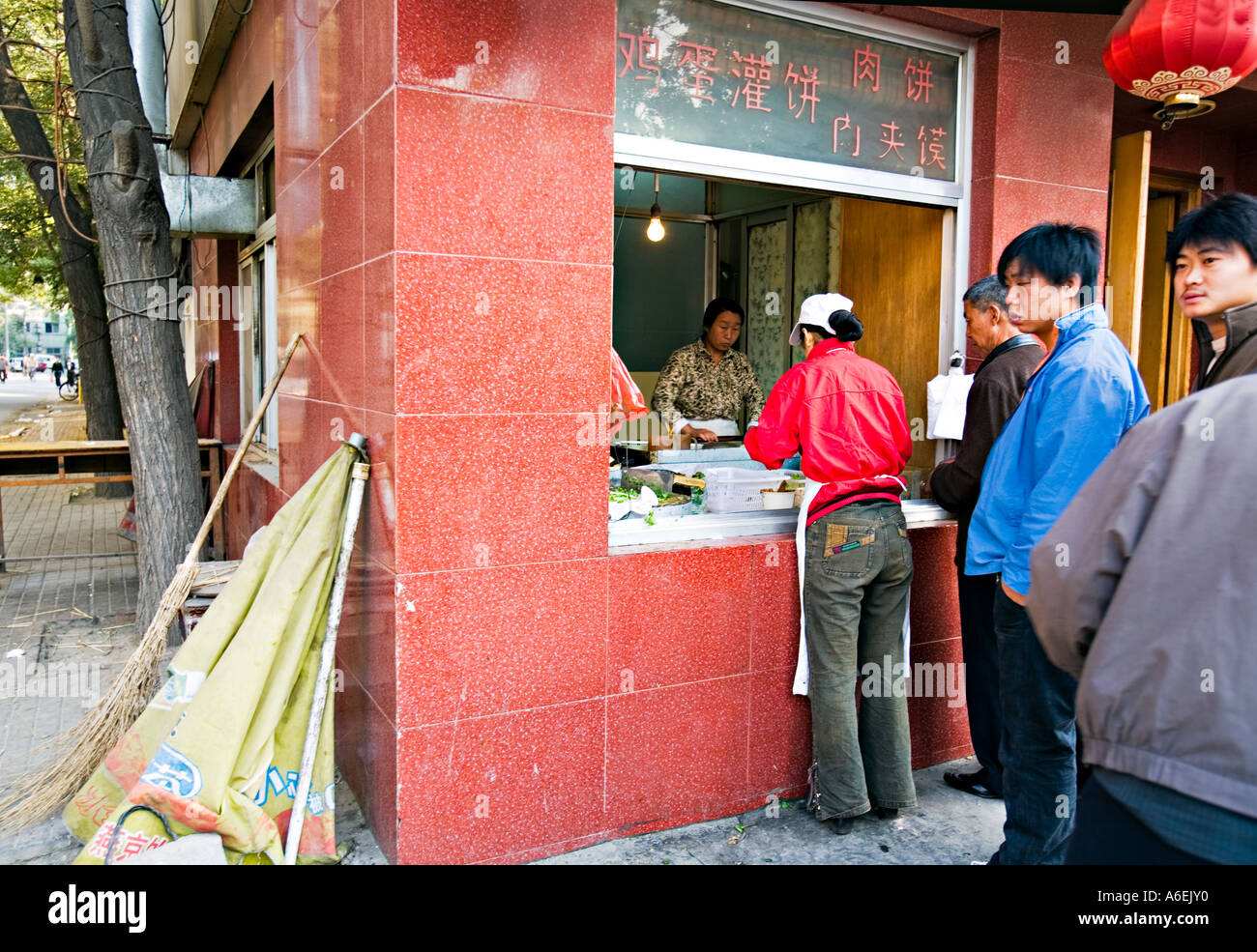 CHINA BEIJING Chinese men lined up at dawn to buy traditional food for ...