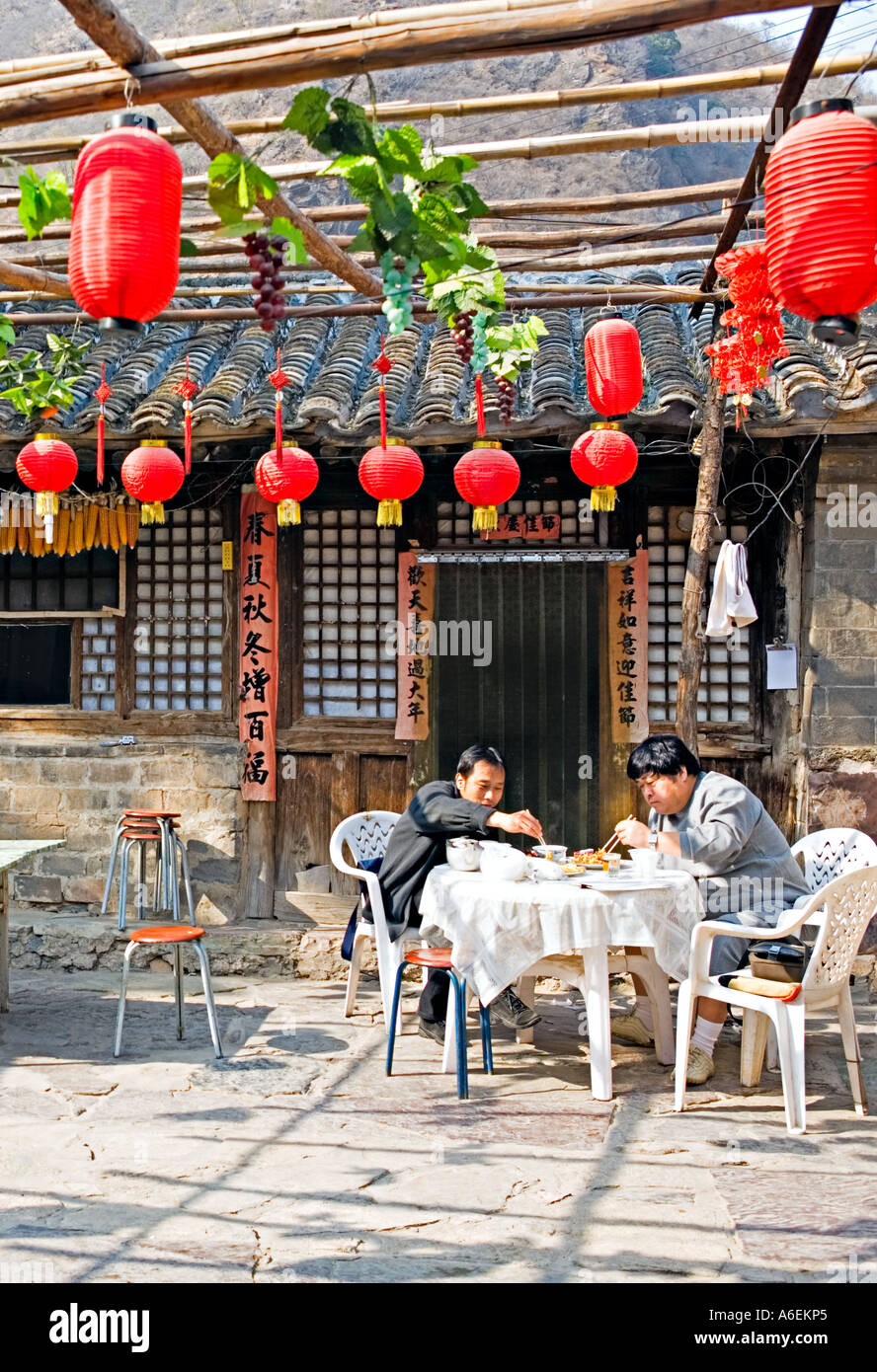 CHINA Chuandixia Chinese couple sharing family style lunch Stock Photo ...
