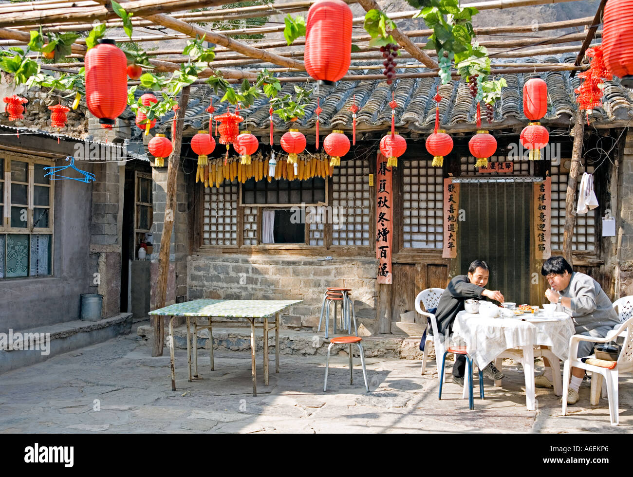 CHINA Chuandixia Chinese couple sharing family style lunch of many ...