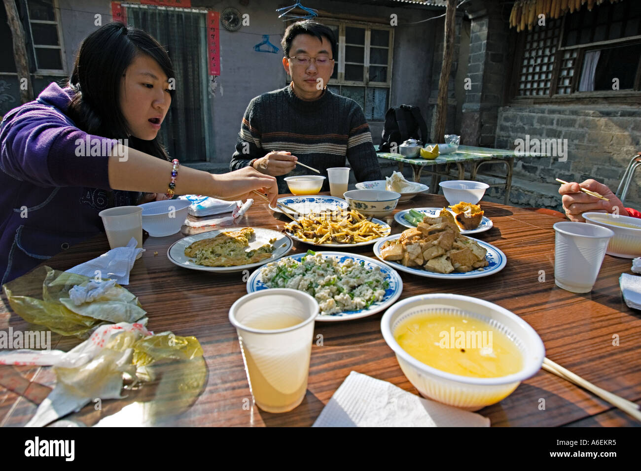 CHINA Chuandixia Chinese couple sharing family style lunch Stock Photo ...