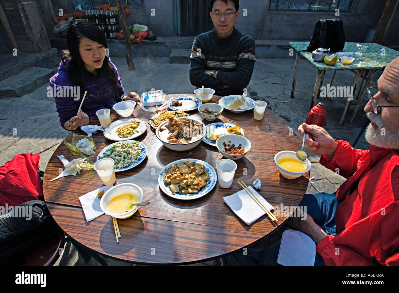 CHINA Chuandixia Chinese couple and American tourist sharing family ...