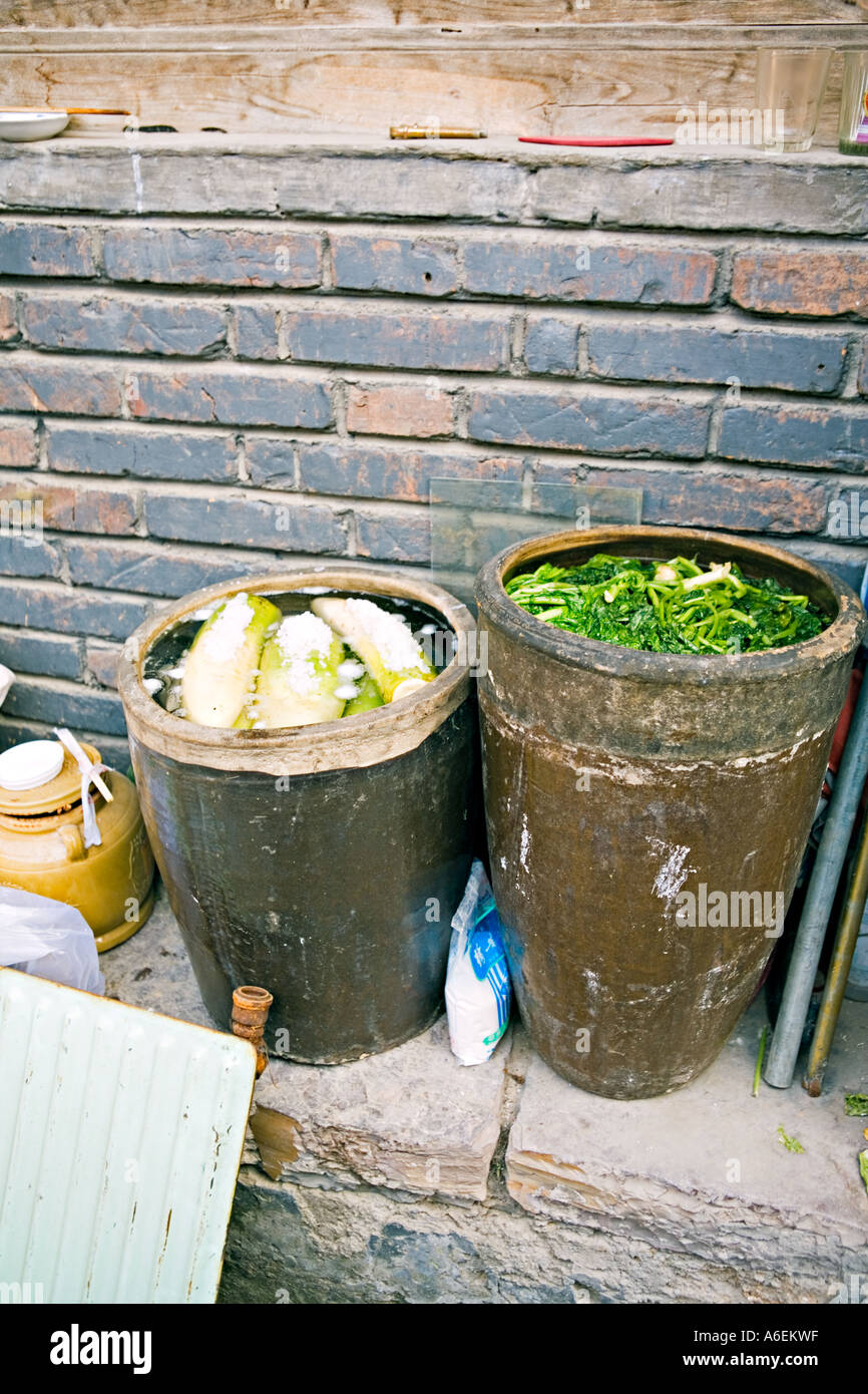 CHINA Chuandixia Pottery crocks of vegetables being preserved in a ...