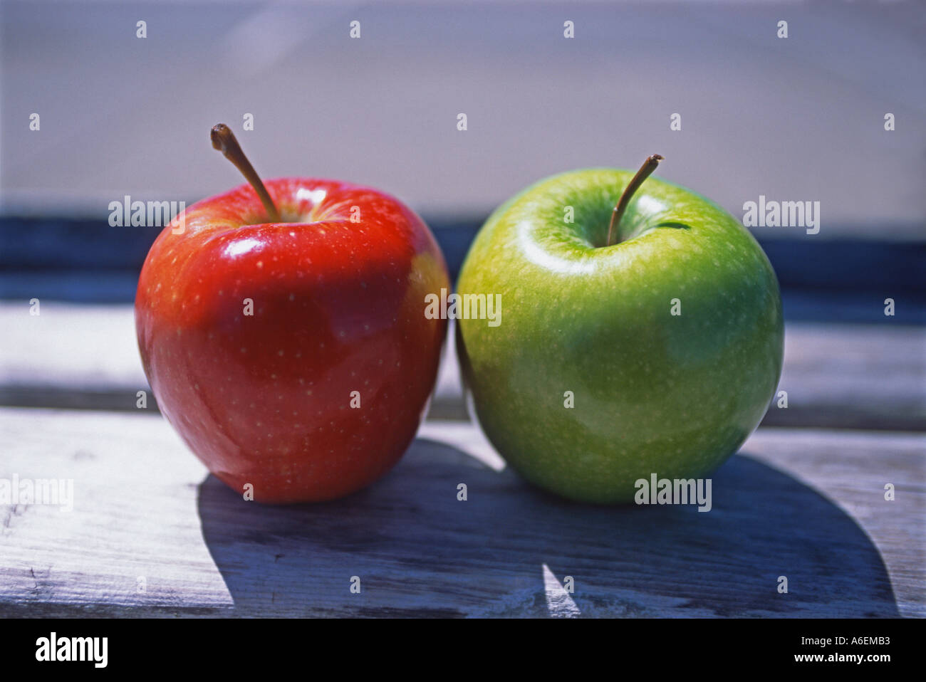 "red apple and green apple, on a bench Stock Photo - Alamy