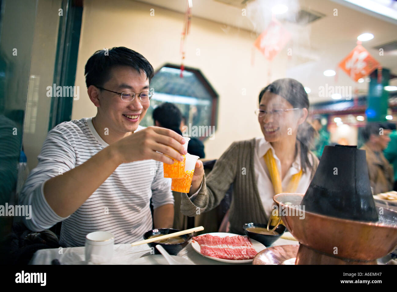 CHINA BEIJING Young Chinese couple toast each other at celebratory ...
