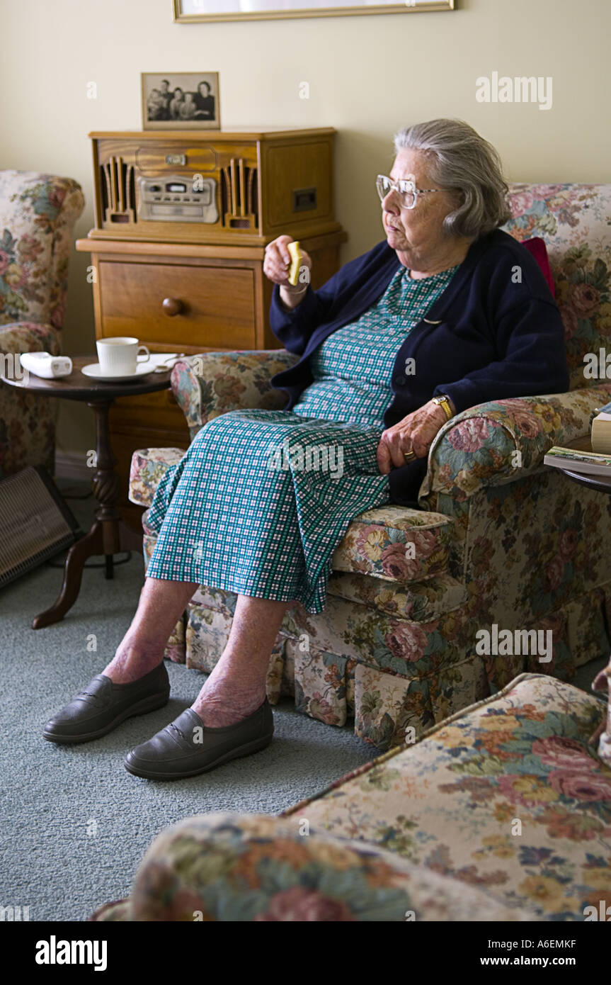 Elderly lady at home having afternoon tea Stock Photo - Alamy