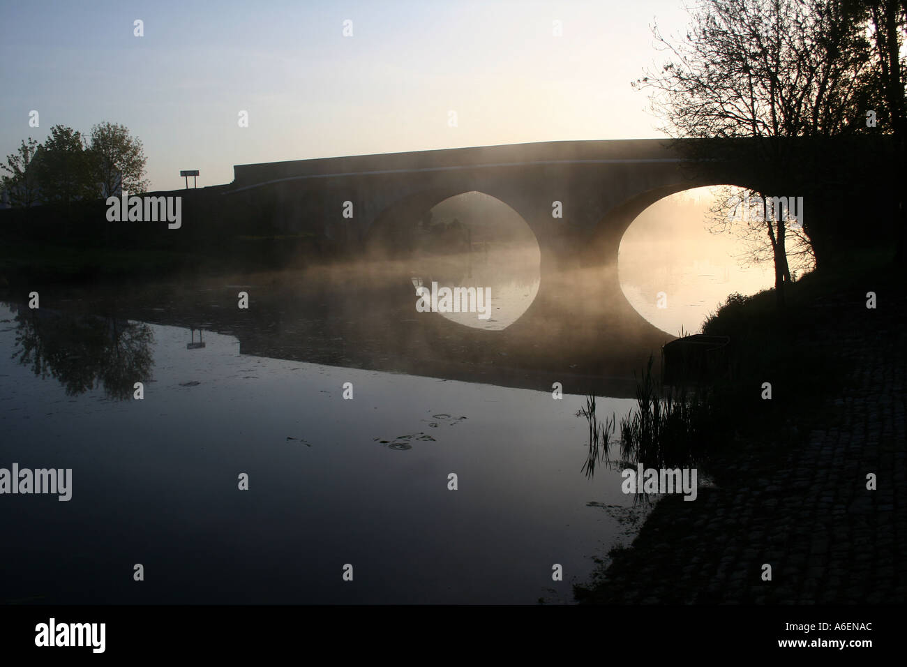 Mist rising from the water of the River Vendee, France. Image taken at ...