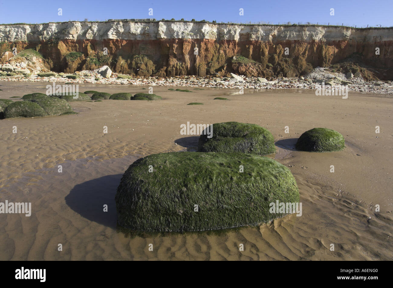 Hunstanton cliffs in Norfolk at low tide UK showing the red chalk white ...
