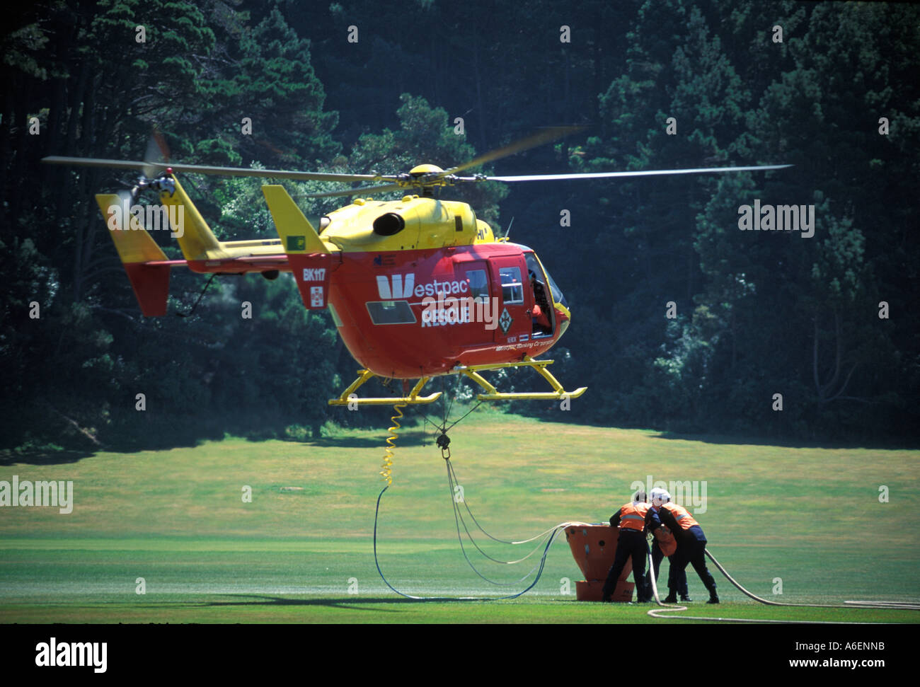 The Westpac Rescue Helicopter with monsoon bucket fights a fire in ...