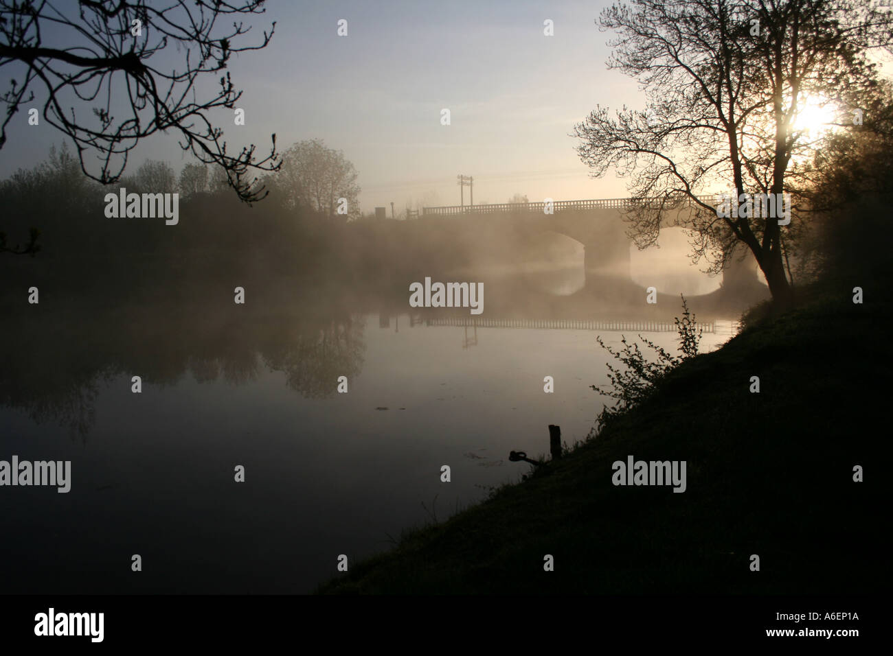 Mist rising from the water of the River Vendee, France. Image taken at ...