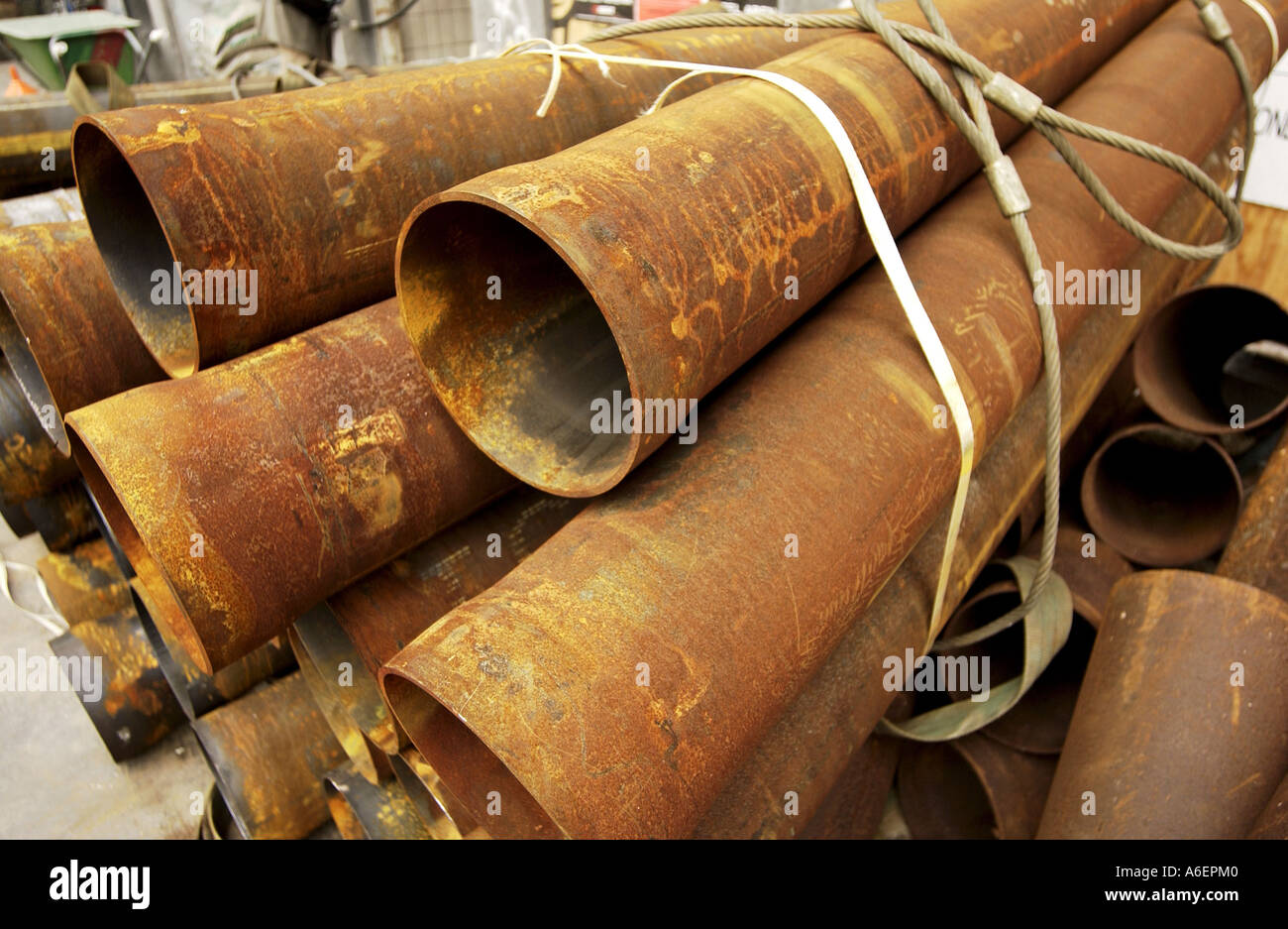 Rusted pipes stored at a construction site Stock Photo - Alamy