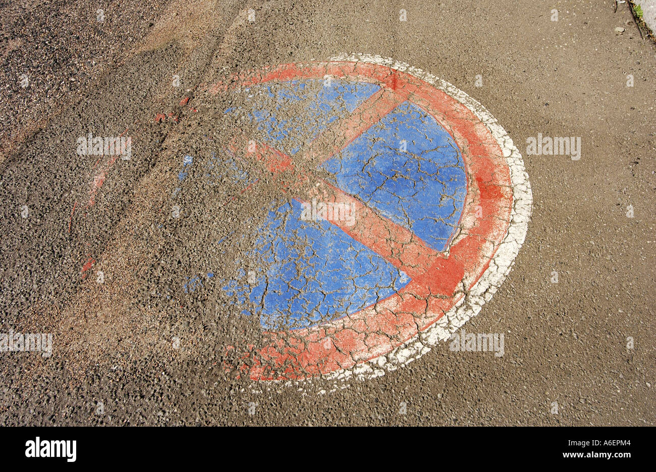 Old stopping restriction sign on the tarmac Stock Photo - Alamy