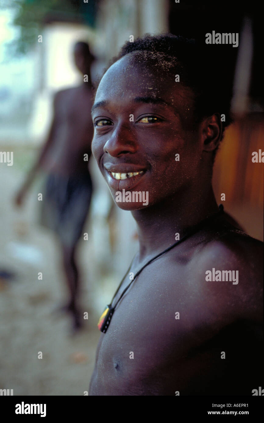 Portrait of a young Gambian fisherman on the beach near Kachically ...