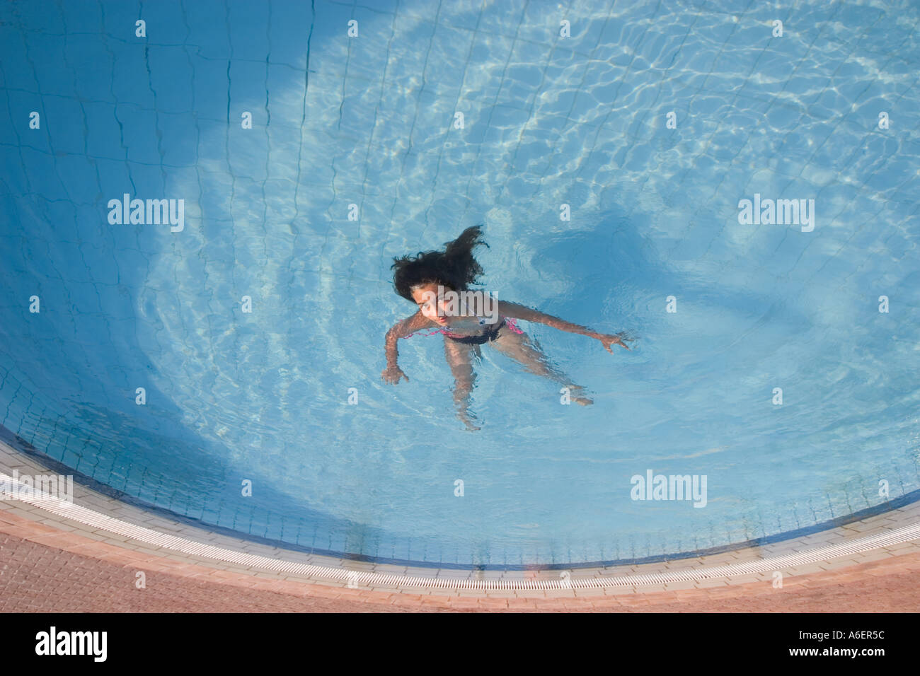 Teenage Girl Alone in Swimming Pool Stock Photo - Alamy