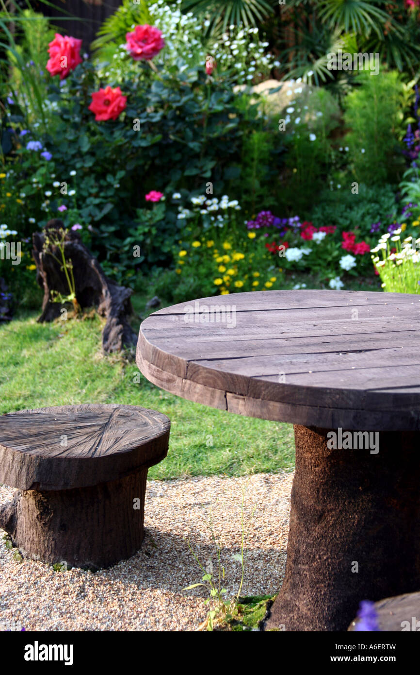 Beautiful garden with chair / table / furniture Stock Photo - Alamy