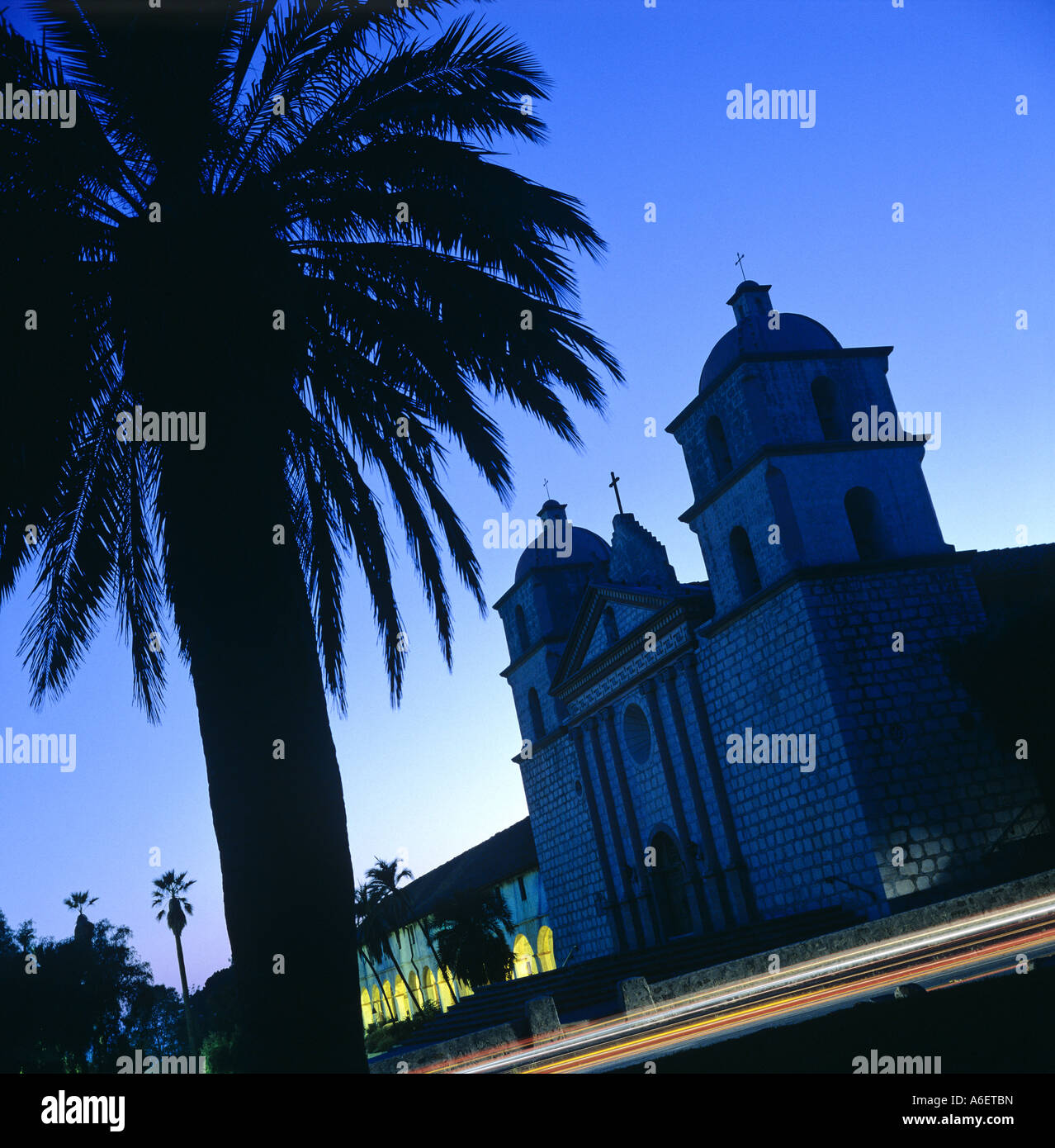 USA, California, Santa Barbara, mission church, palm tree at dusk Stock ...