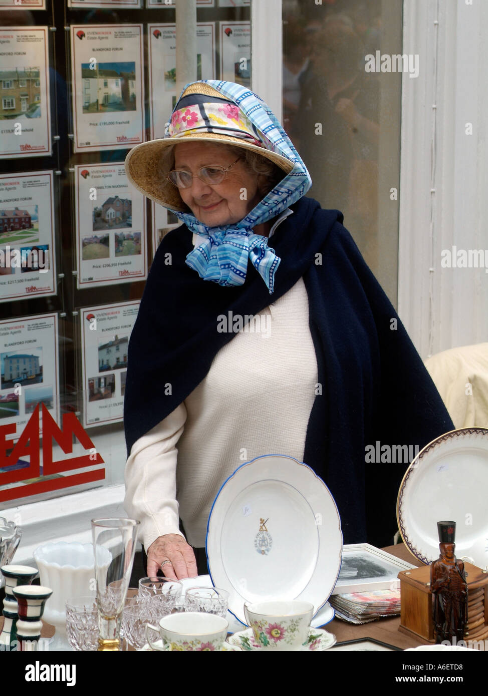A woman market stall trader wearing a traditional dress during a May ...