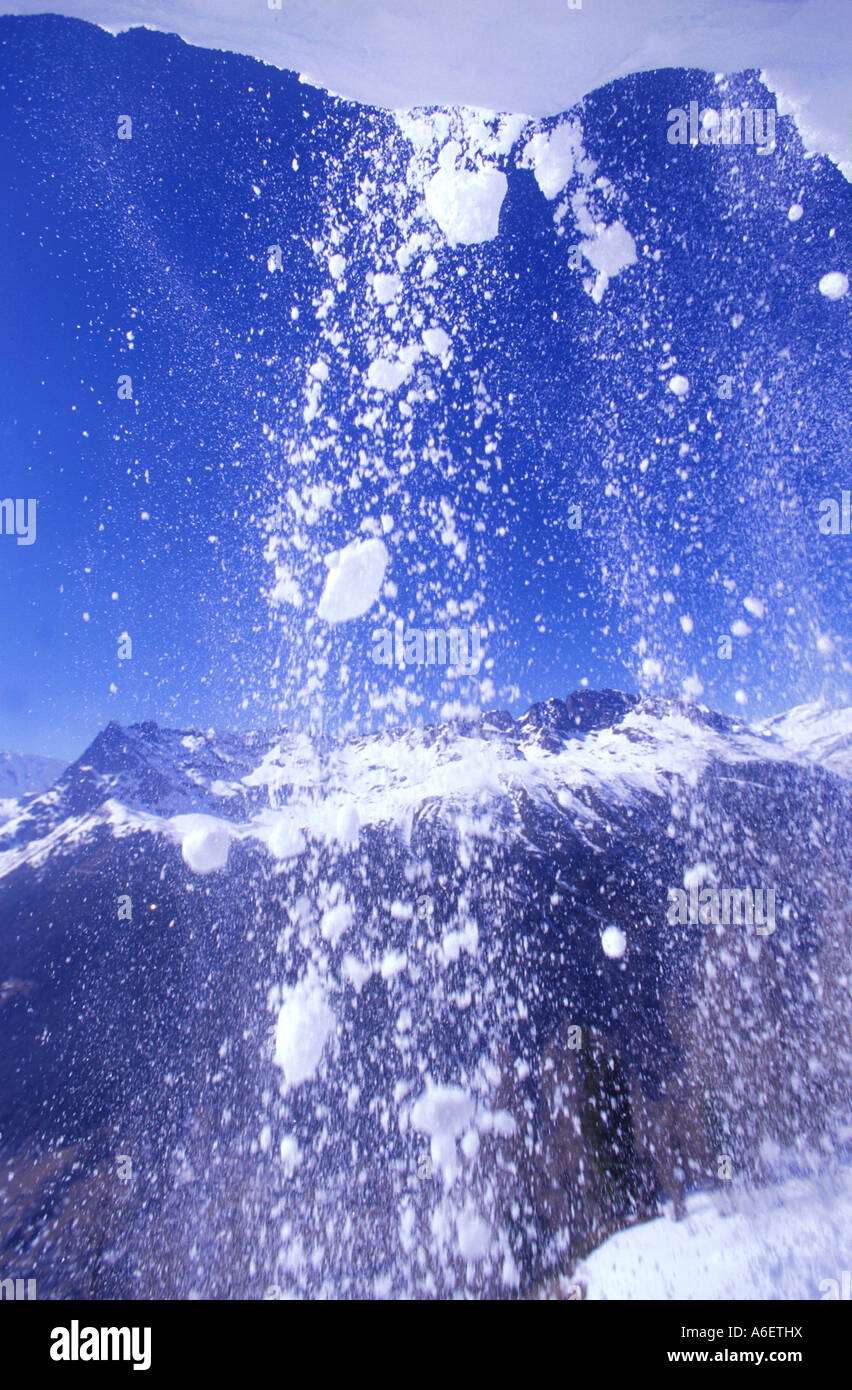 Snow falling from a cornice Stock Photo - Alamy