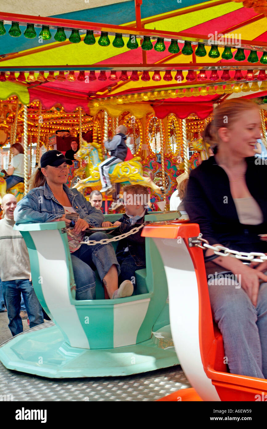 People having fun riding an amusement park ride Stock Photo - Alamy