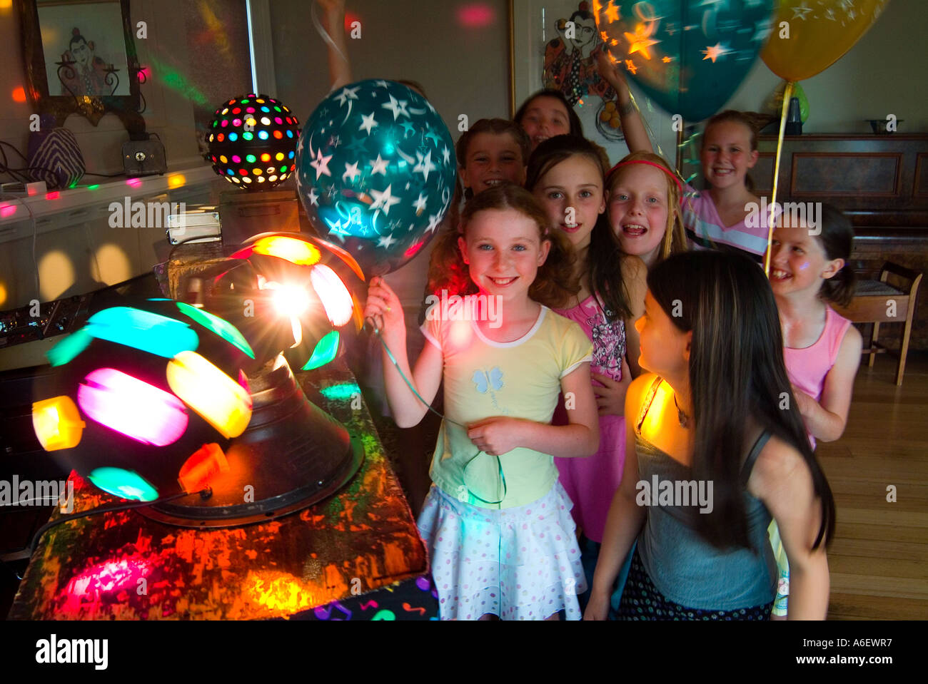 Excited nine year old girls at a birthday party with disco lights Stock ...