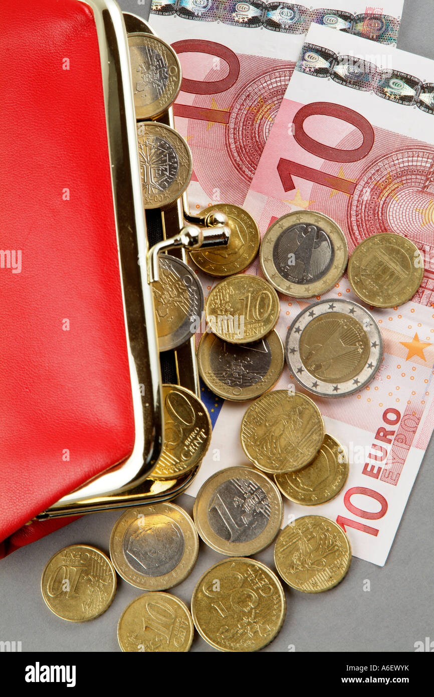 Money and a red leather purse Cash Loose change European coinage Euros Stock Photo - Alamy