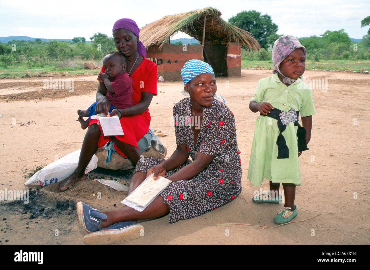 Mothers waiting at an open-air health clinic. nr Binga, Zimbabwe Stock ...
