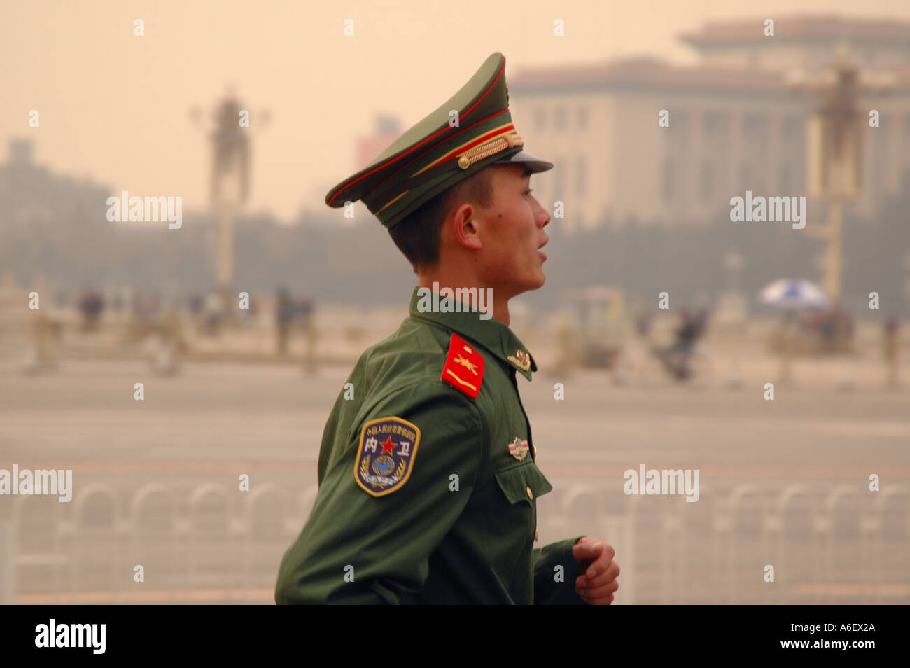Soldier running in front of Tienanmen square at the Forbidden City in ...
