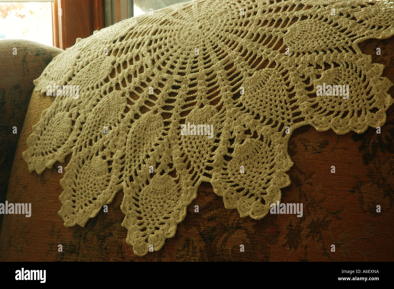 Elegant knitted doily on the top of a chair Stock Photo - Alamy