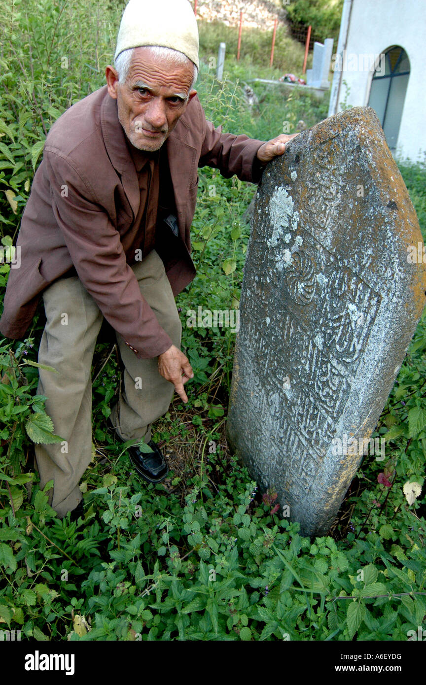 Old man showing very old Tombstone Stock Photo - Alamy