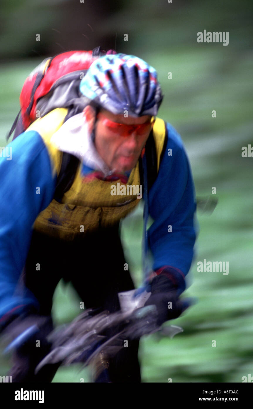 Biking man at speed Stock Photo - Alamy