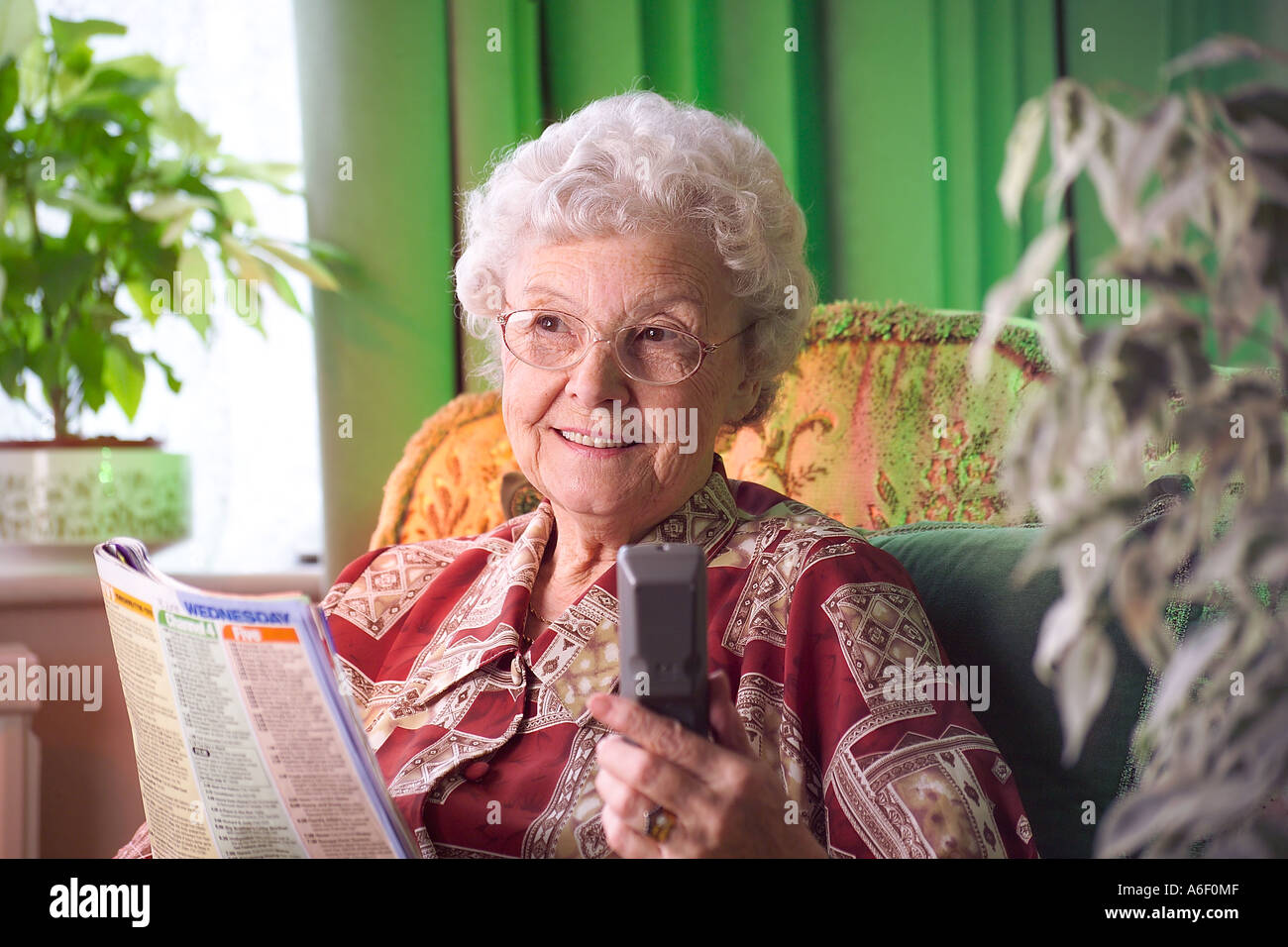 old lady reading a magazine Stock Photo - Alamy