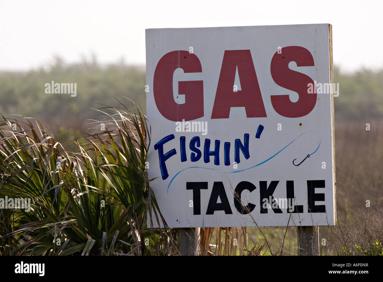 Sign advertising gas and fishing tackle Stock Photo - Alamy