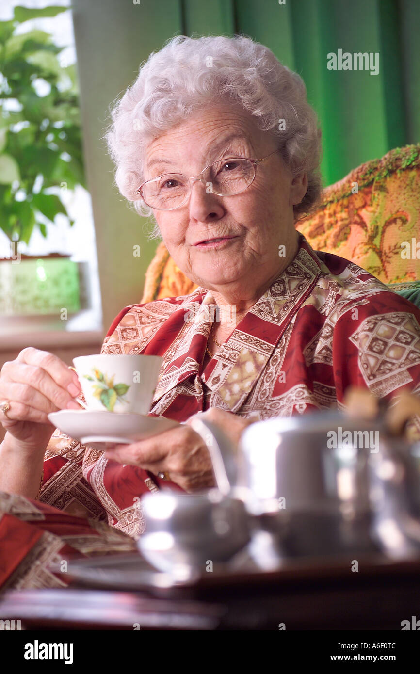 old lady having a cup of tea Stock Photo - Alamy