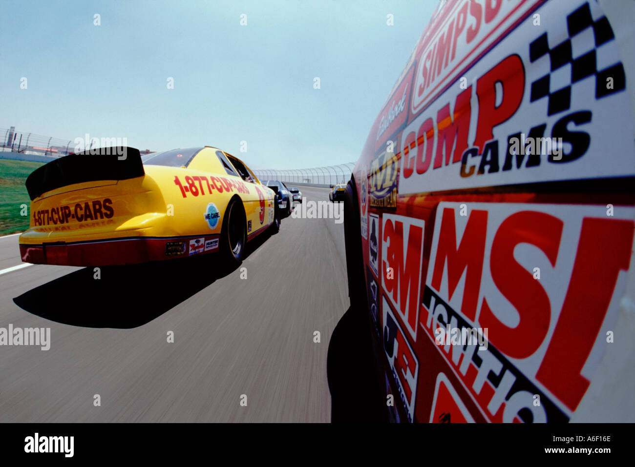 NASCAR style race cars during race shot from fender mounted camera ...