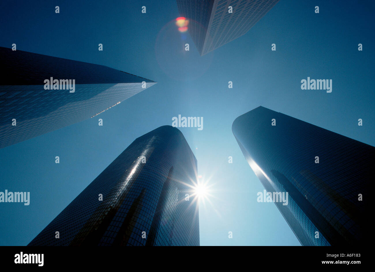 Looking up at Sky Scrapers with sun flare Stock Photo - Alamy