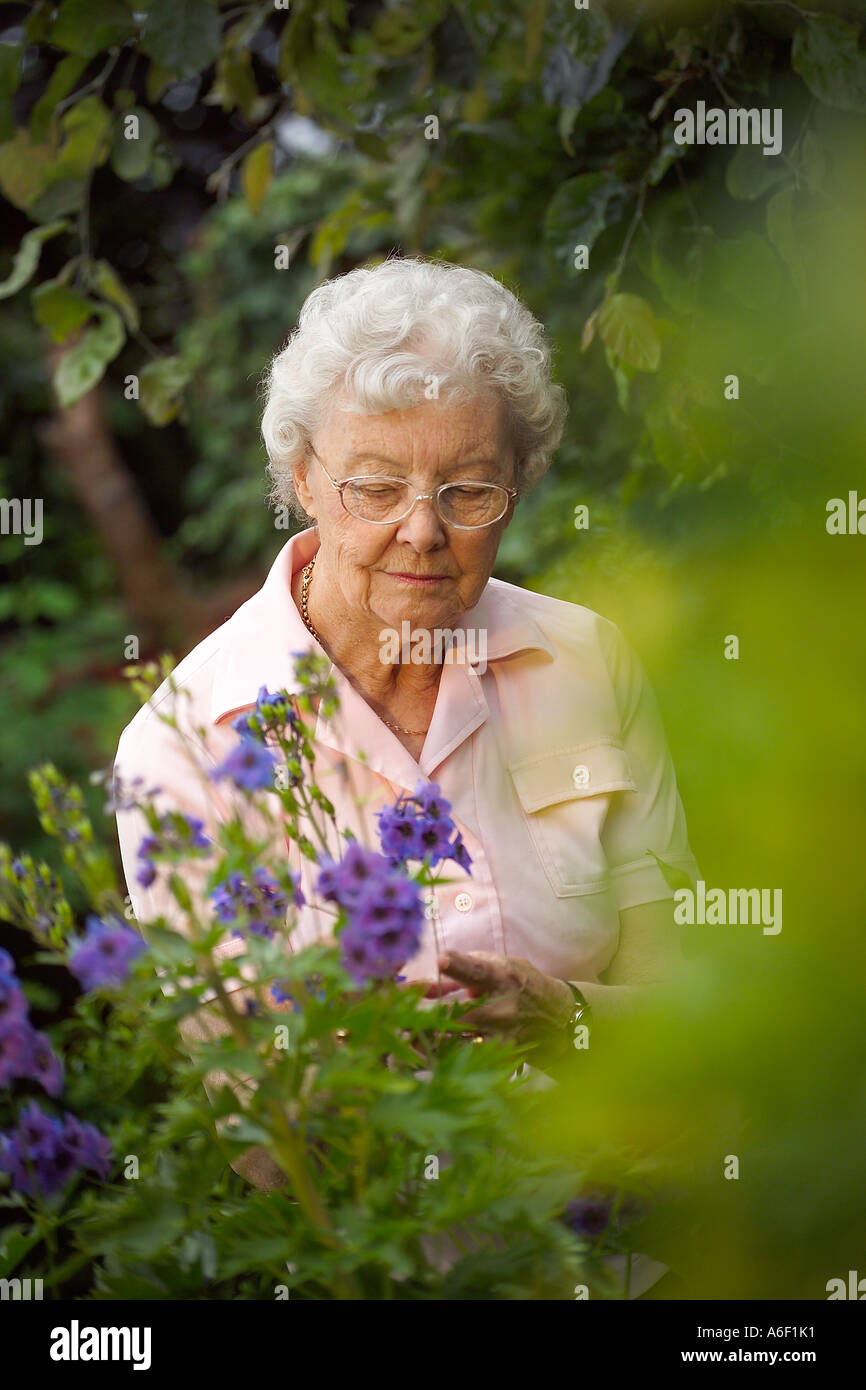Old Lady in her garden Stock Photo - Alamy