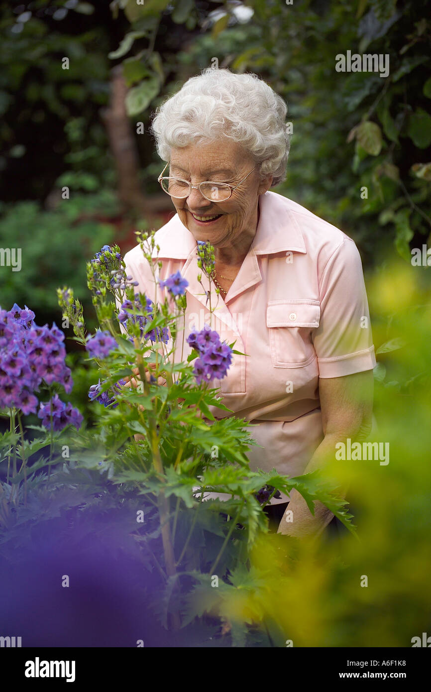Old Lady in her garden Stock Photo - Alamy