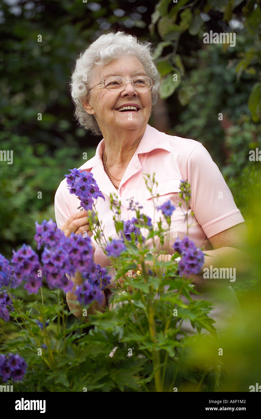 Old Lady in her garden Stock Photo - Alamy