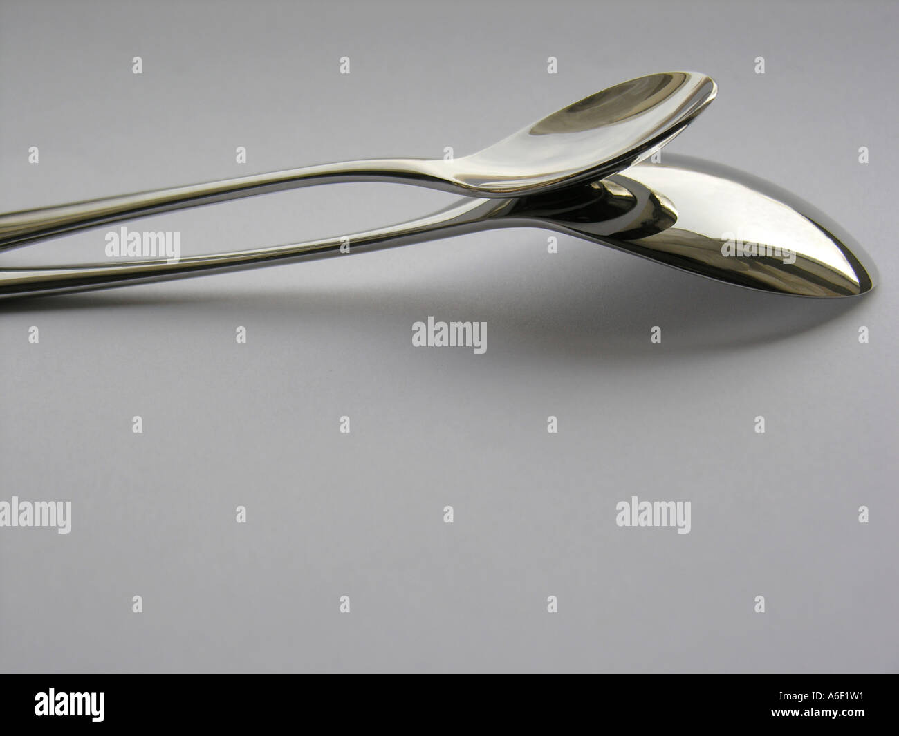 Two steel spoons Stock Photo - Alamy