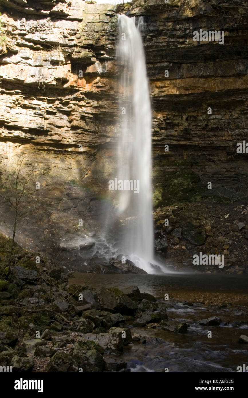 waterfall cascading onto rocks at Hardraw Force Hardraw Yorkshire Dales ...