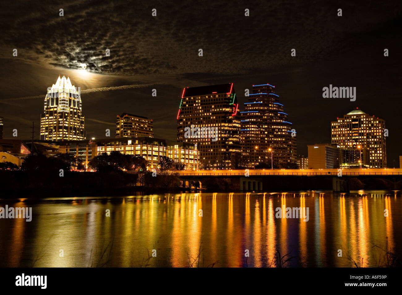 TEXAS Austin City skyline reflected in Town Lake at dusk full moon ...