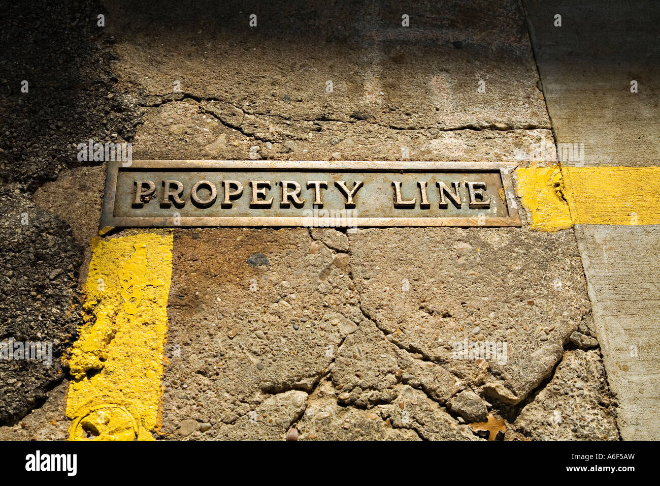 TEXAS Austin Property Line plaque embedded in pavement yellow lines ...