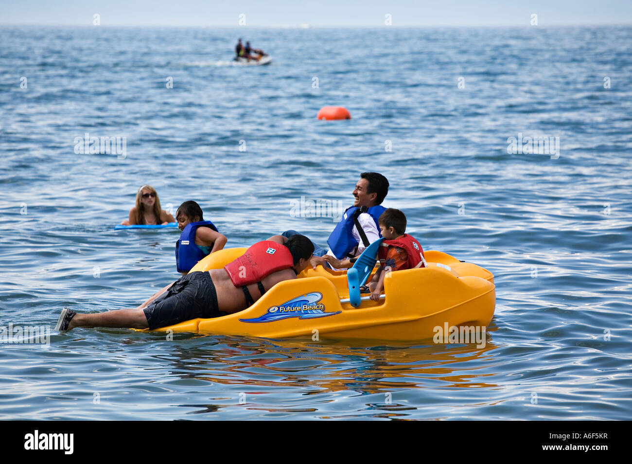 CALIFORNIA South Lake Tahoe Hispanic family enjoy yellow paddle boat on ...