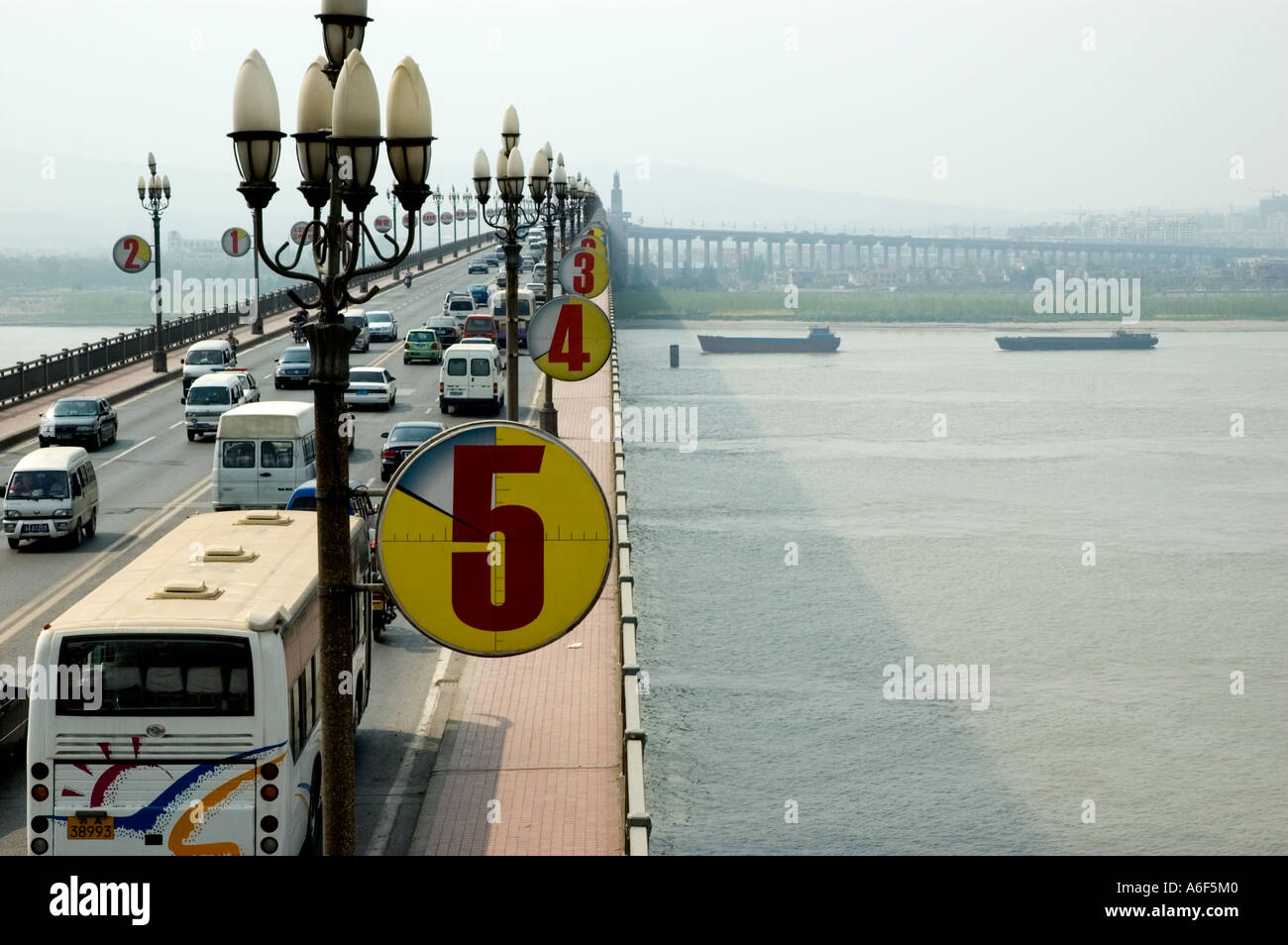 Busy road traffic crossing the 4-lane Double Decker Bridge across the ...