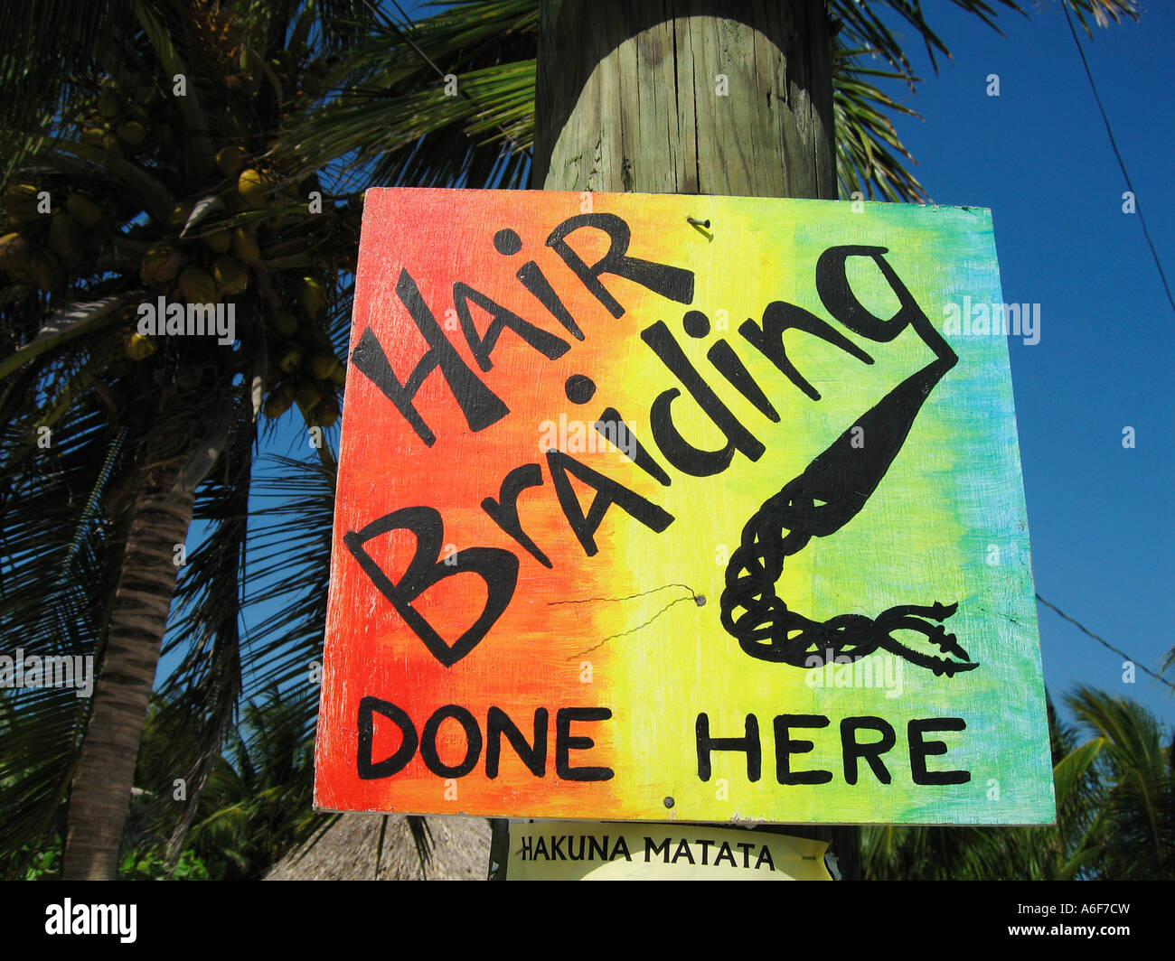BELIZE Caye Caulker Hair braiding done here sign on light post colorful ...