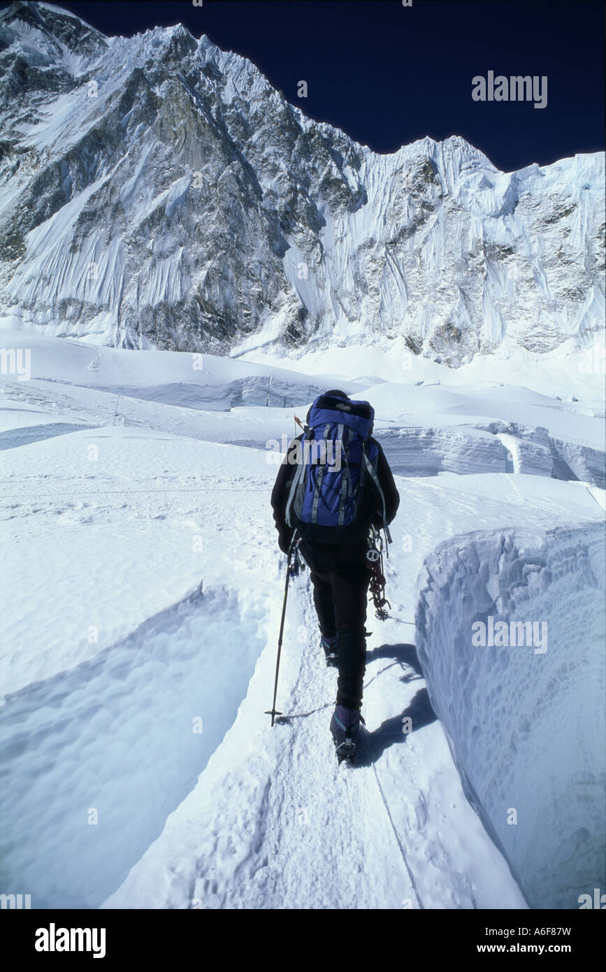 Crossing a crevasse on Mount Everest in the Khumbu Icefall Stock Photo ...